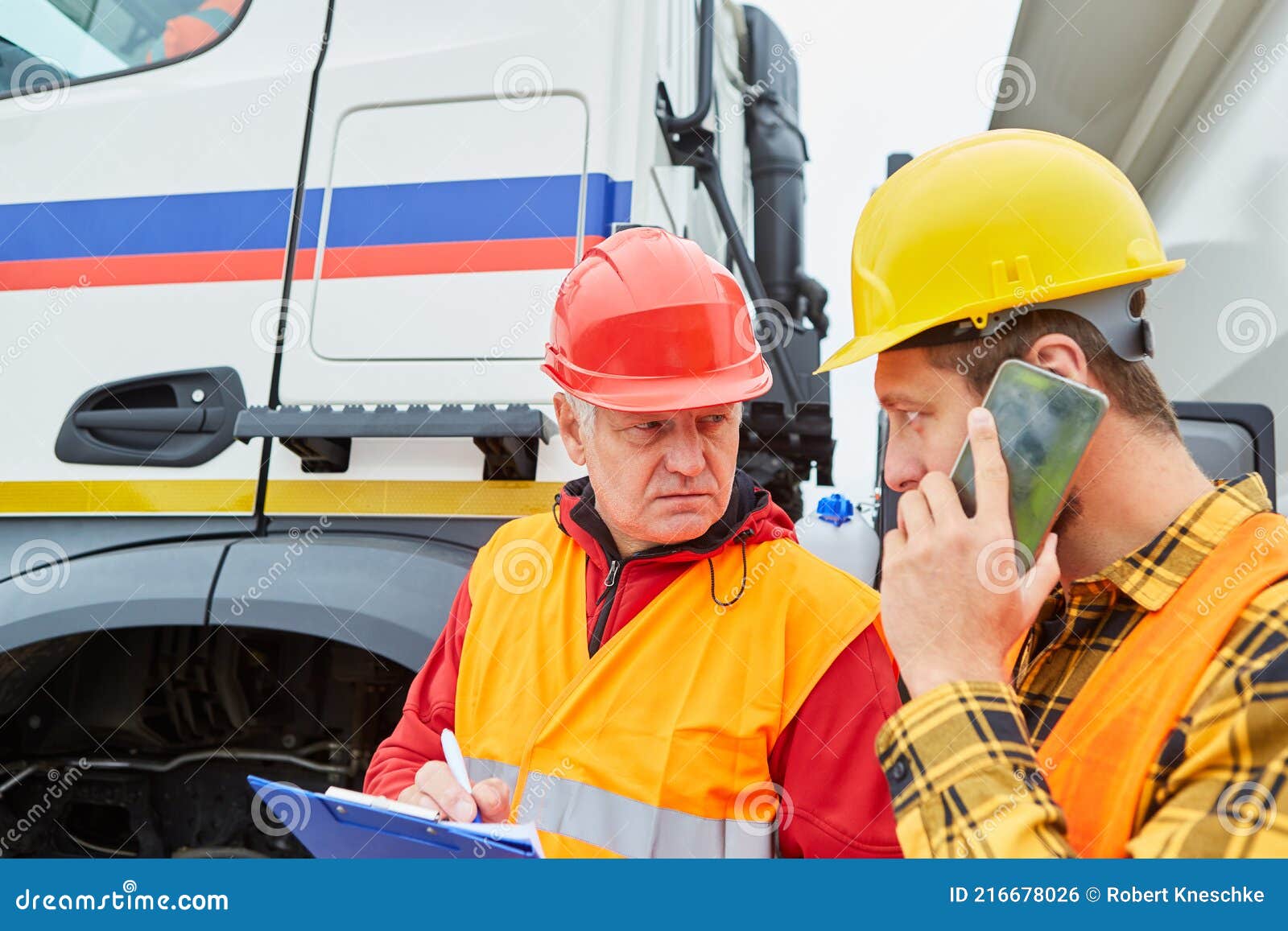 Construction Worker and Architect with Cellphone and Checklist Stock ...