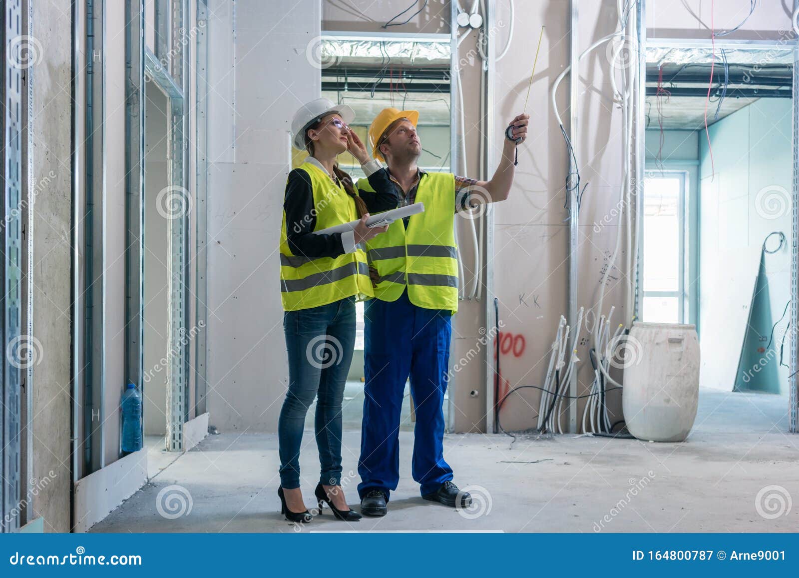 Construction Worker and Architect Discussing Work To Be Done at Site ...