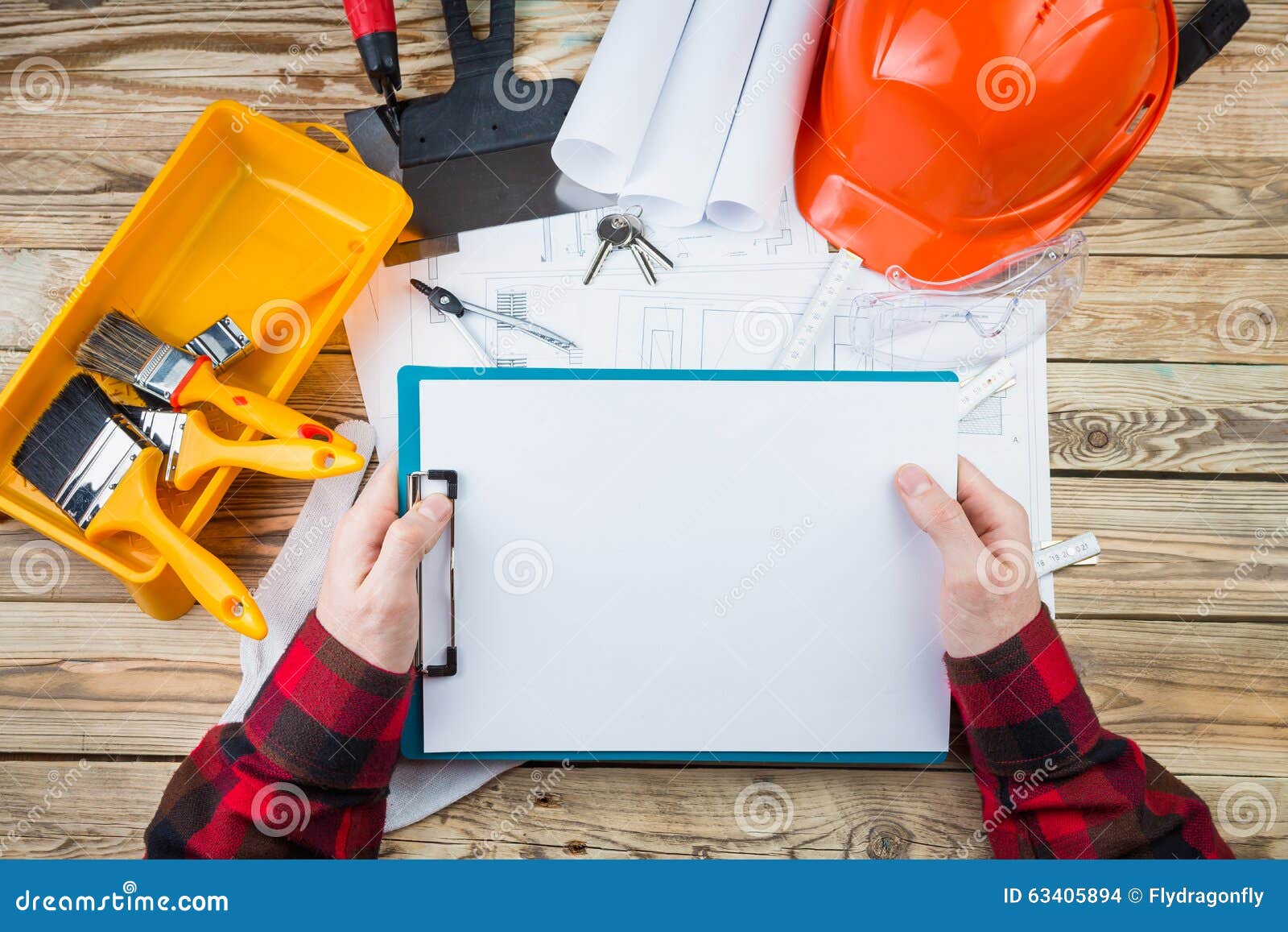 Construction Worker Architect Exploring Blueprints Plans For A New ...