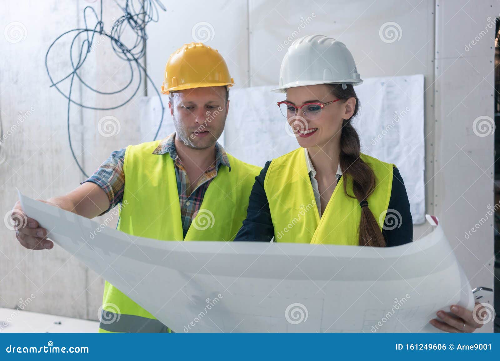 Construction Worker and Architect Reading Plan Stock Photo - Image of ...