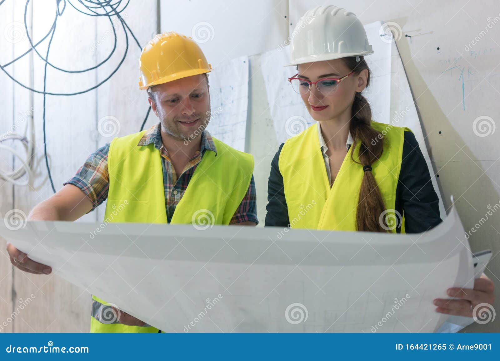 Construction Worker and Architect Reading Plan Stock Image - Image of ...