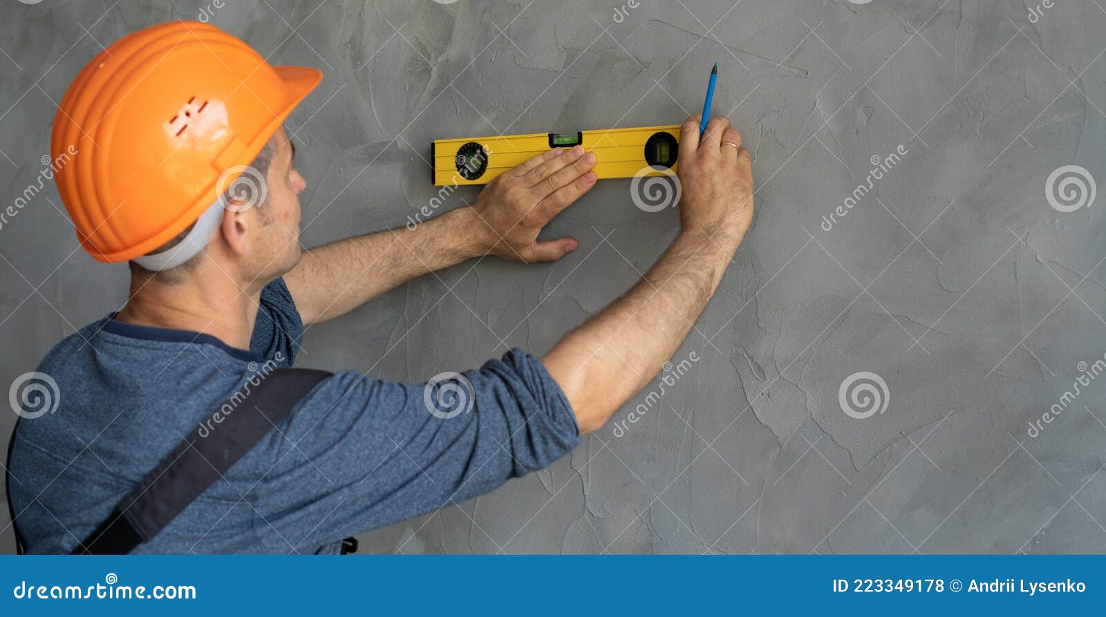 A Construction Worker Or Architect Wearing A Hard Hat Is Checking The ...