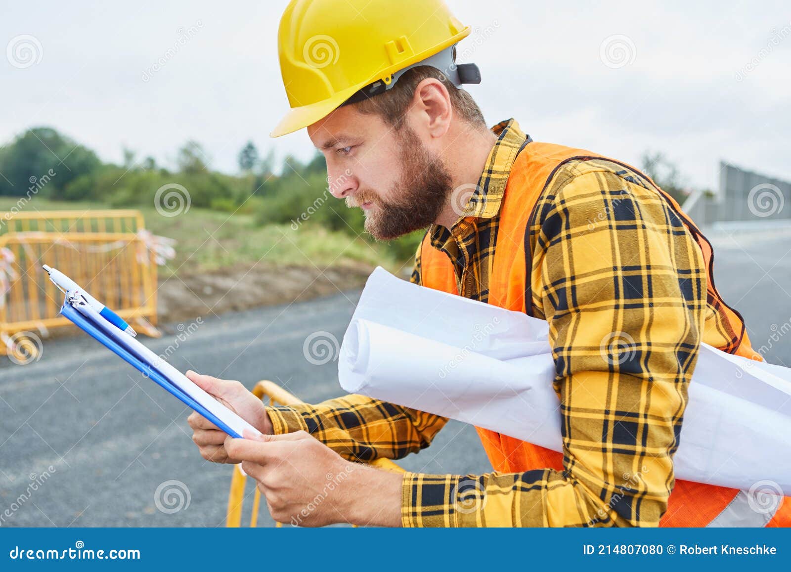Construction Worker As Foreman with Checklist and Blueprint Stock Photo ...