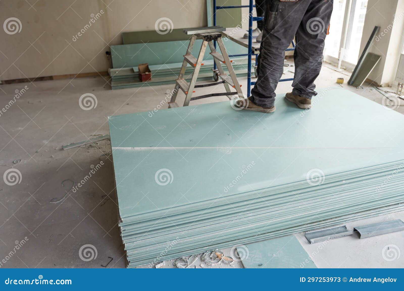 Construction Worker Assemble a Suspended Ceiling with Drywall and ...