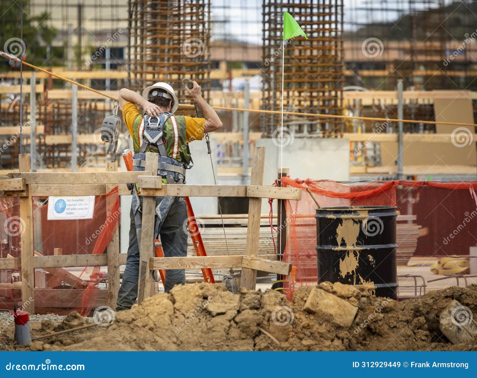A Construction Worker Attaching Himself To a Safety Harness Editorial ...