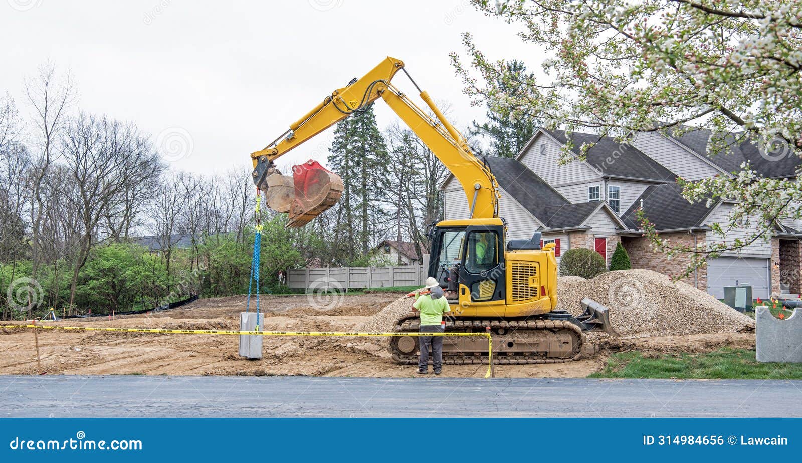 Construction Worker with Backhoe Transporting Concrete Block Editorial ...