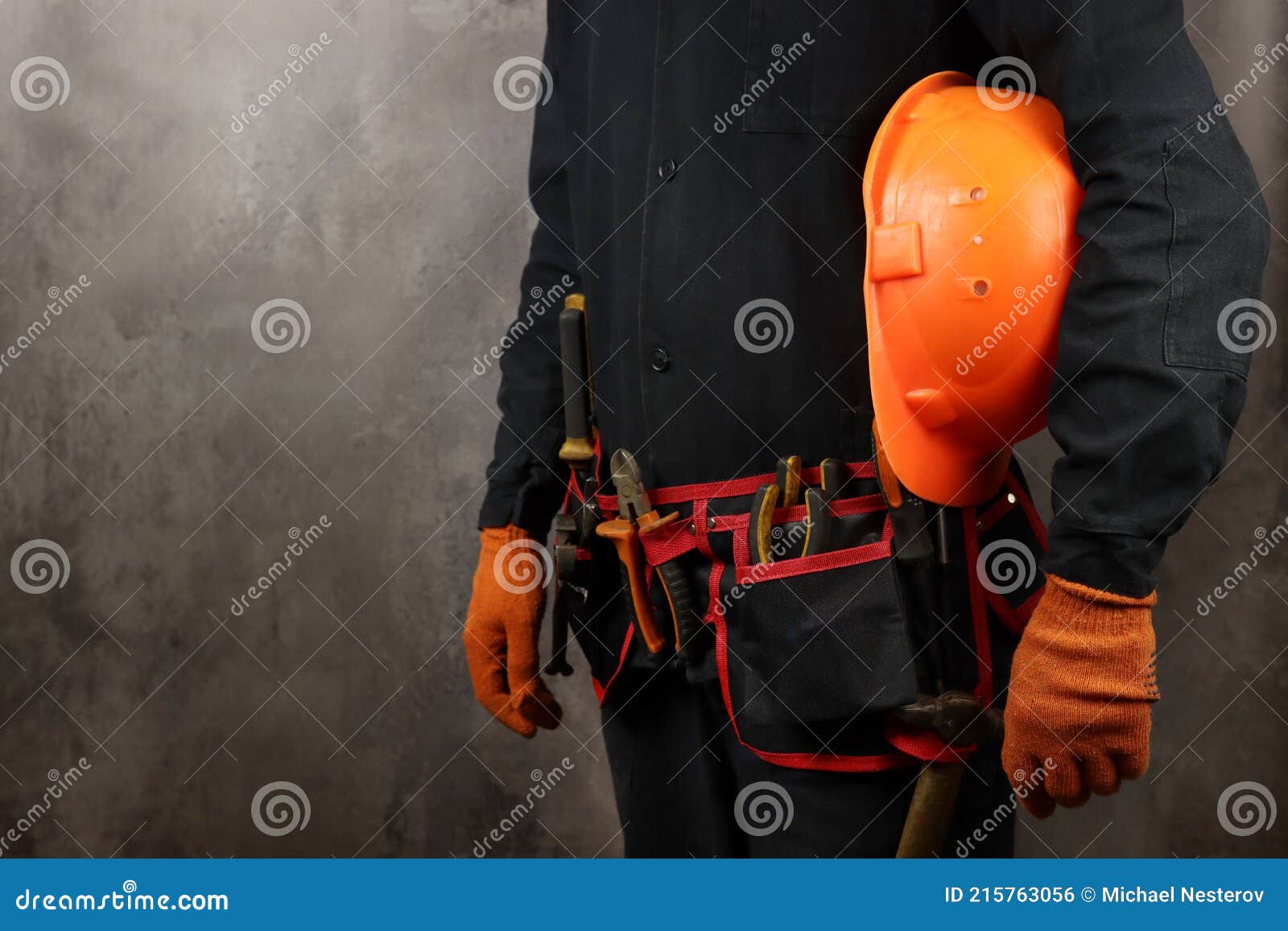 Construction Worker in a Belt with Tools and a Helmet in Hand Stock ...