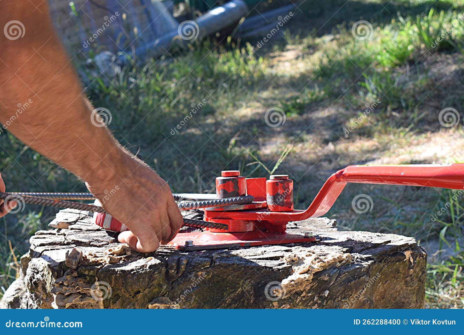 A Construction Worker Bends a Steel Bar into a Concrete Structure Stock ...