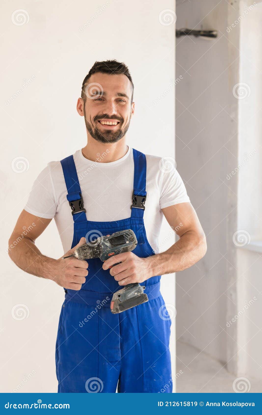 The Builder Holds a Drill in His Hand Stock Image - Image of contractor ...