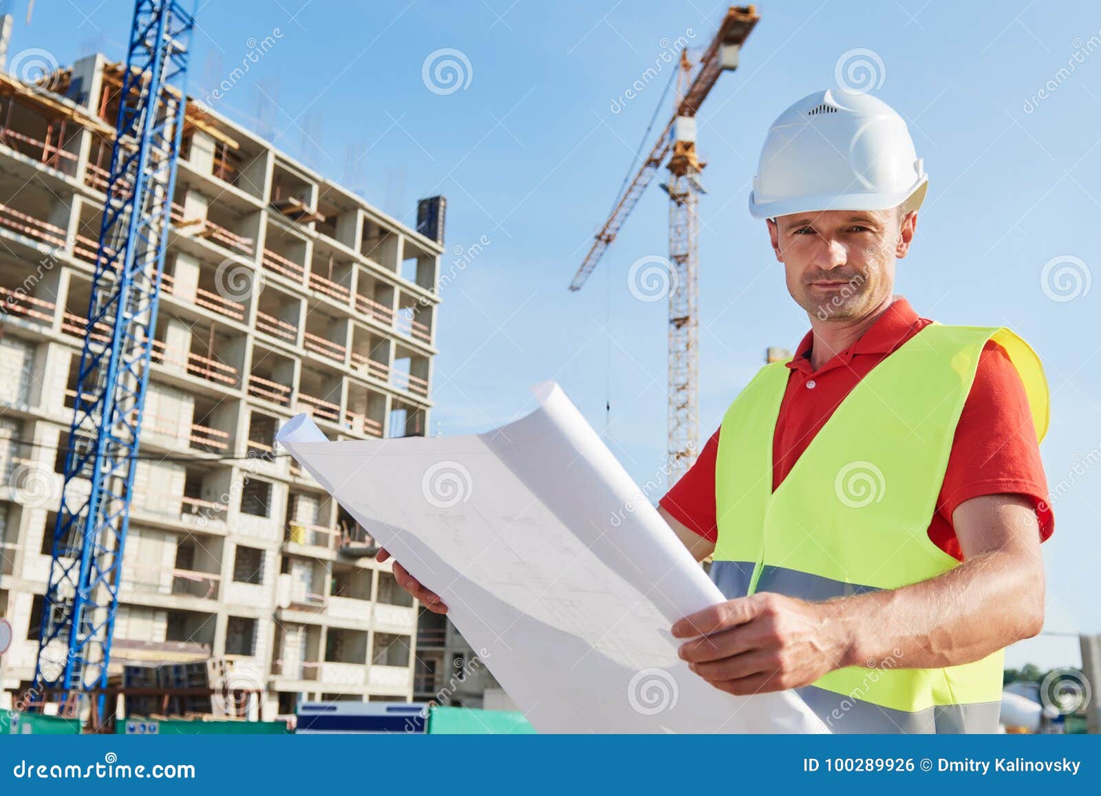 Construction Worker with Blueprint at Building Area Stock Photo - Image ...