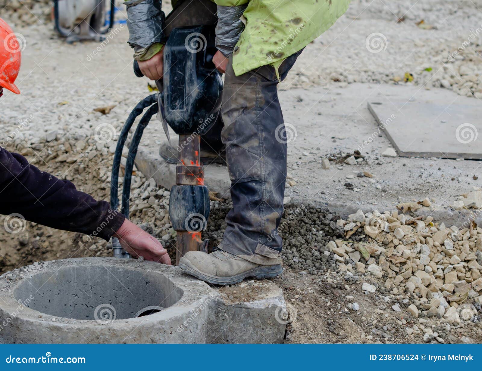 Construction Worker Breaking Concrete Around Road Gully Using Hydraulic ...