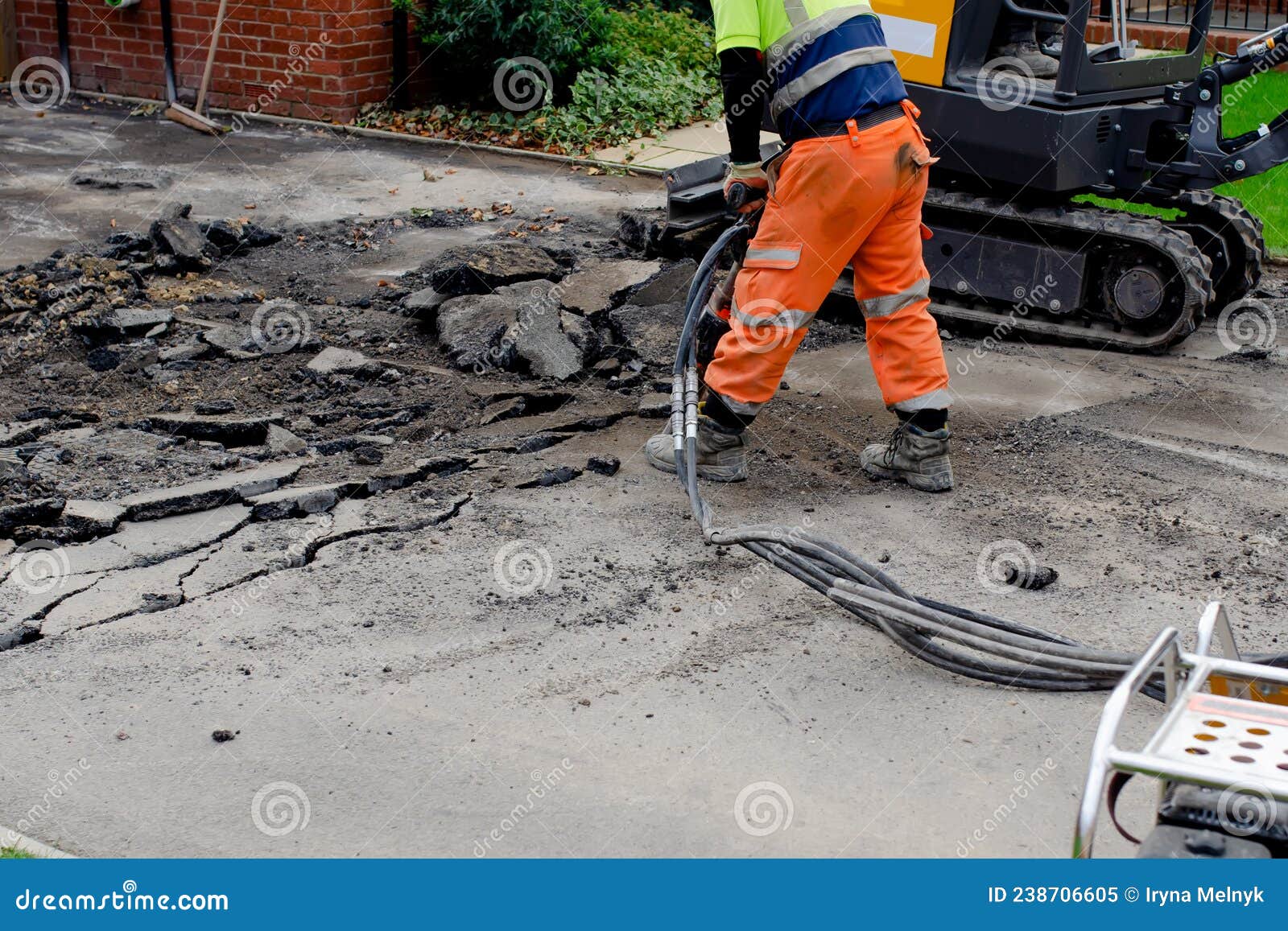 Construction Worker Breaking Road Gully Using Hydraulic Breacker during ...