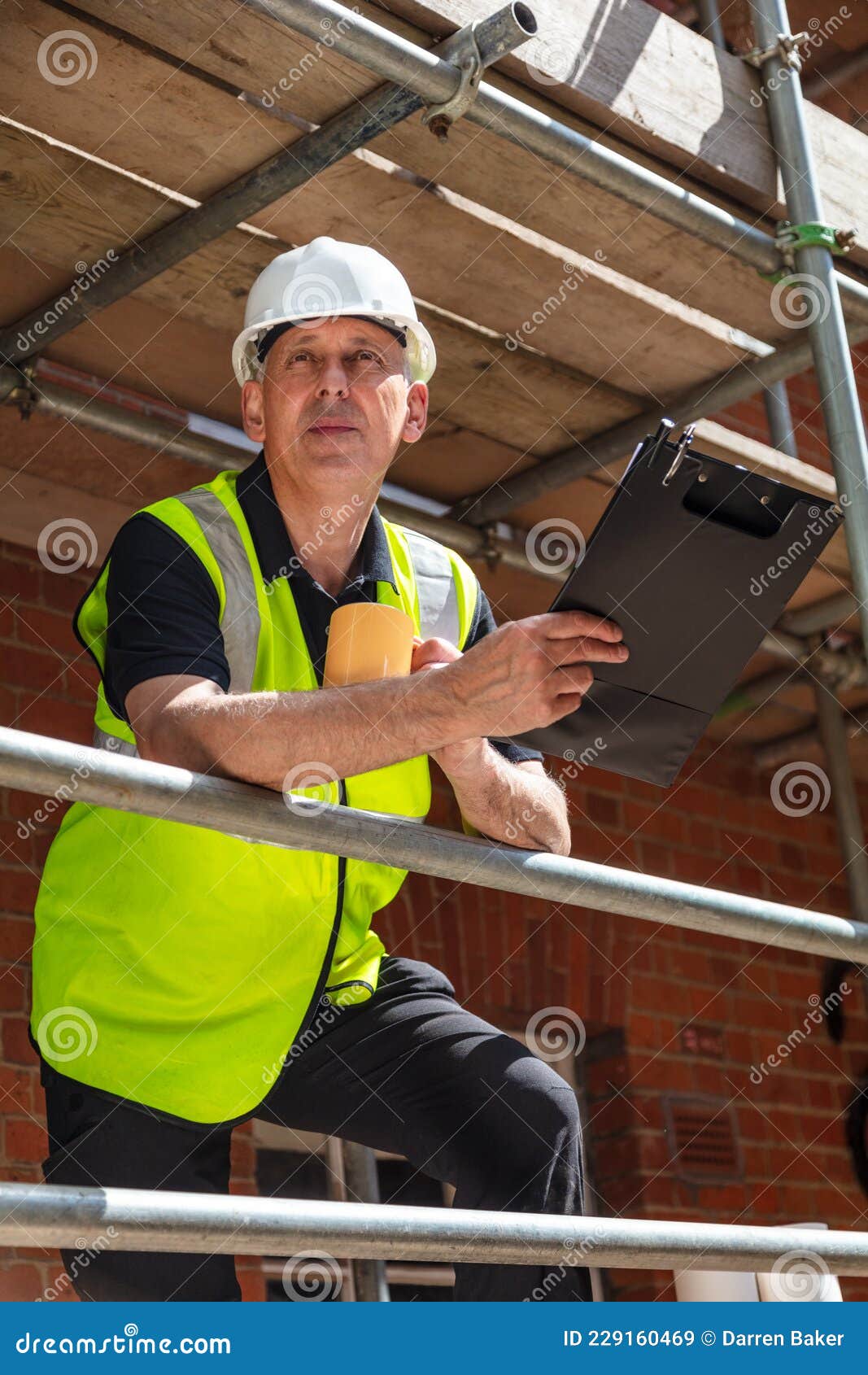 Construction Worker Builder on Building Site Clipboard and Mug Stock ...