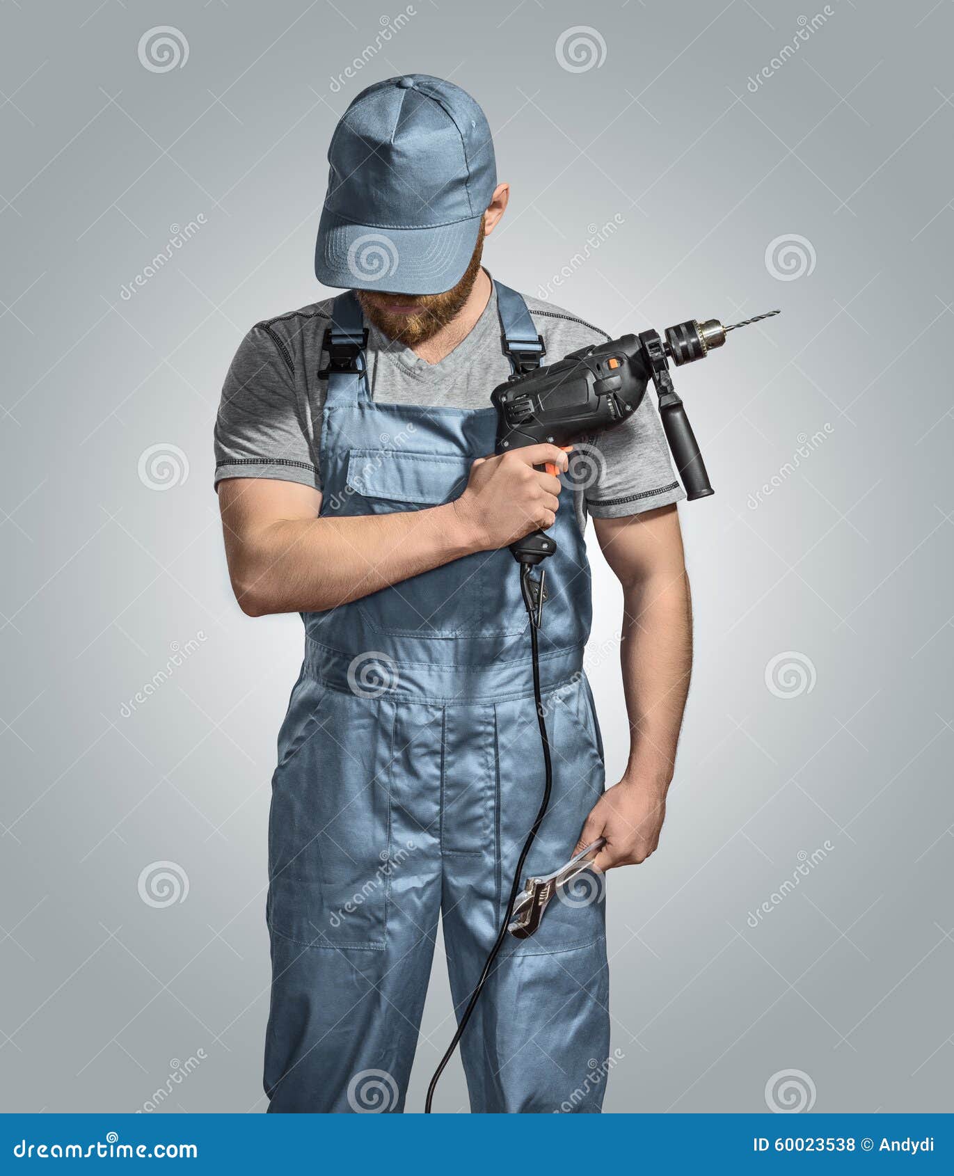 Construction Worker Builder with Drill and Wrench on the Isolated ...