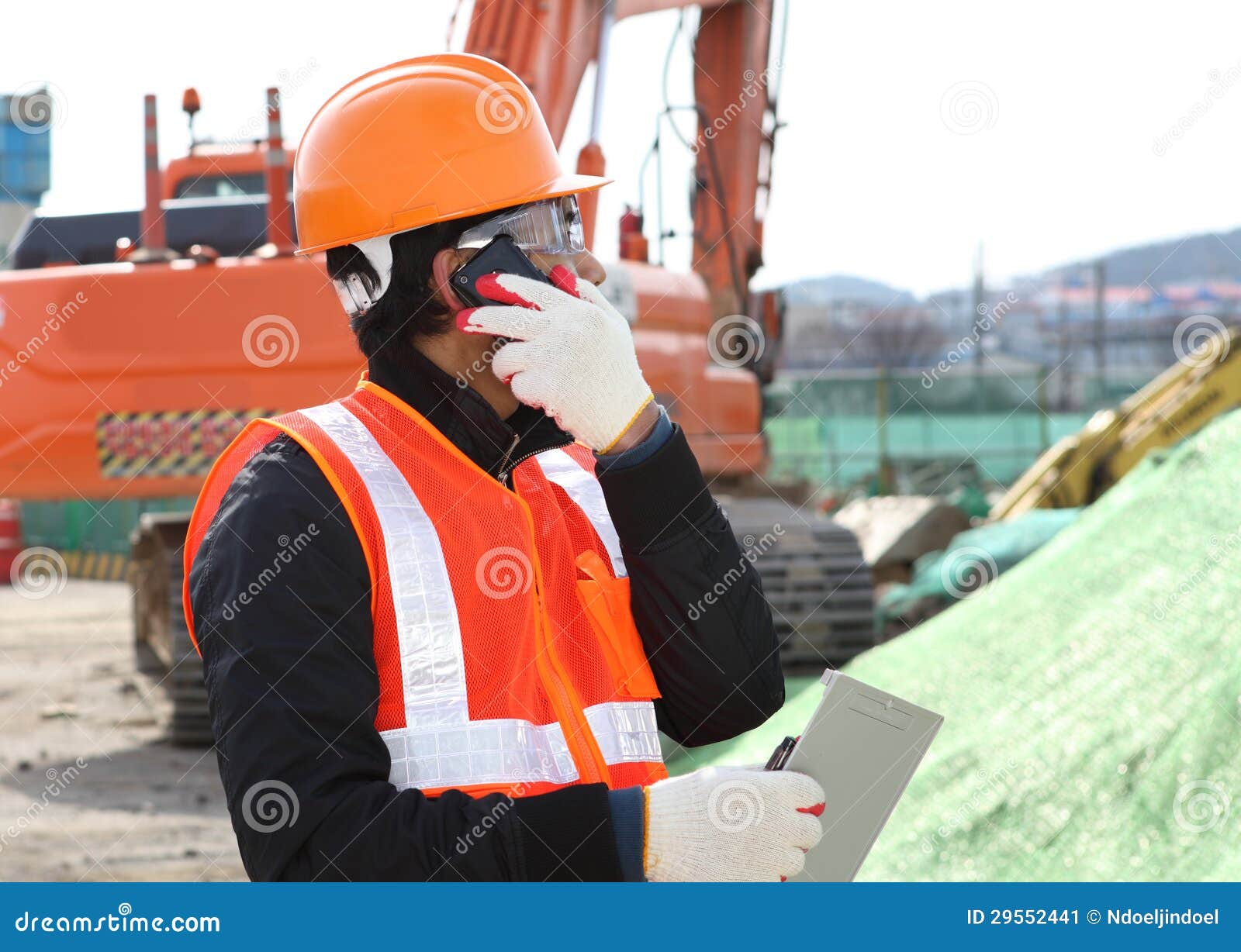 Construction Worker with Building Plans and Cellphone Stock Image ...