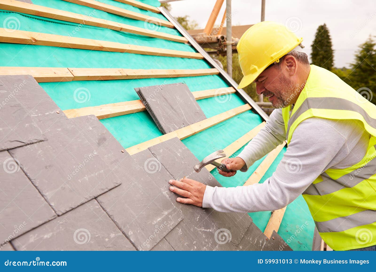 Construction Worker on Building Site Laying Slate Tiles Stock Image ...