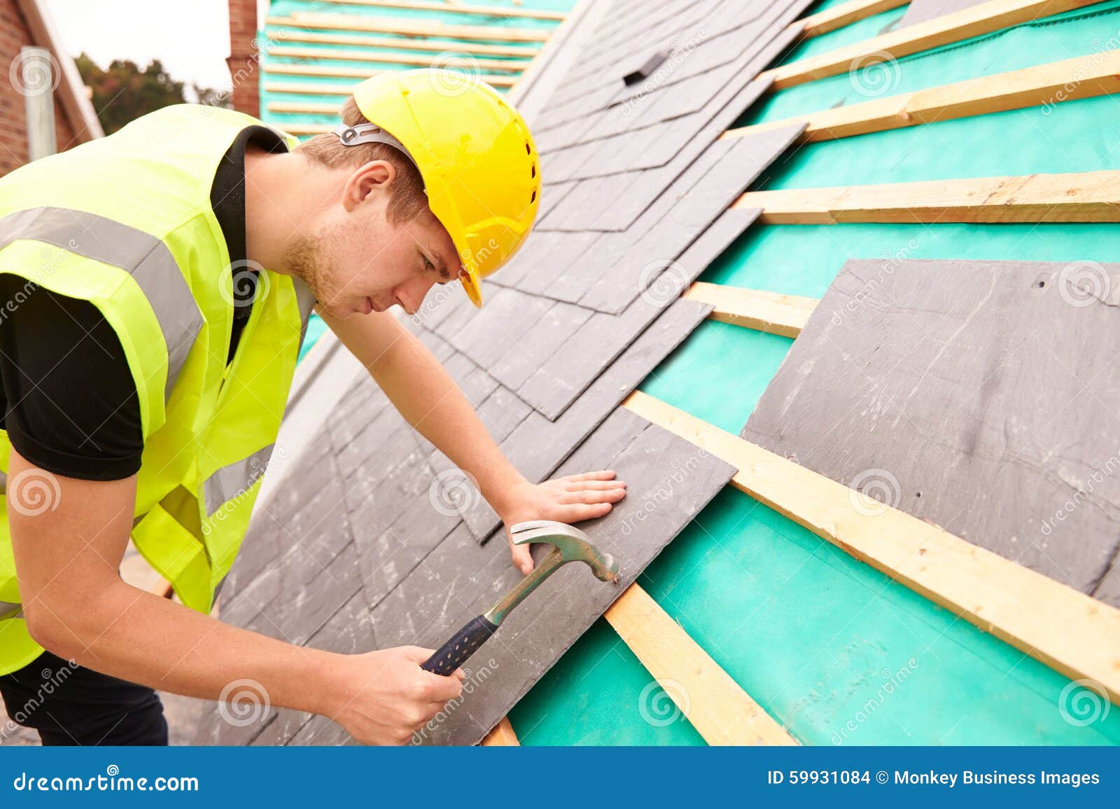 Construction Worker on Building Site Laying Slate Tiles Stock Photo ...