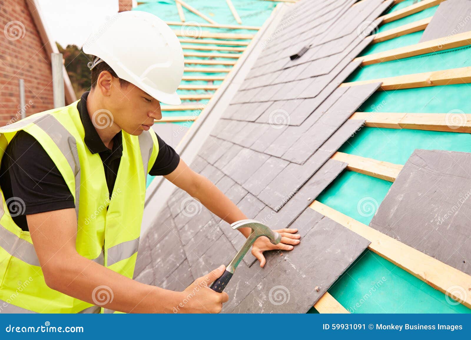 Construction Worker on Building Site Laying Slate Tiles Stock Image ...