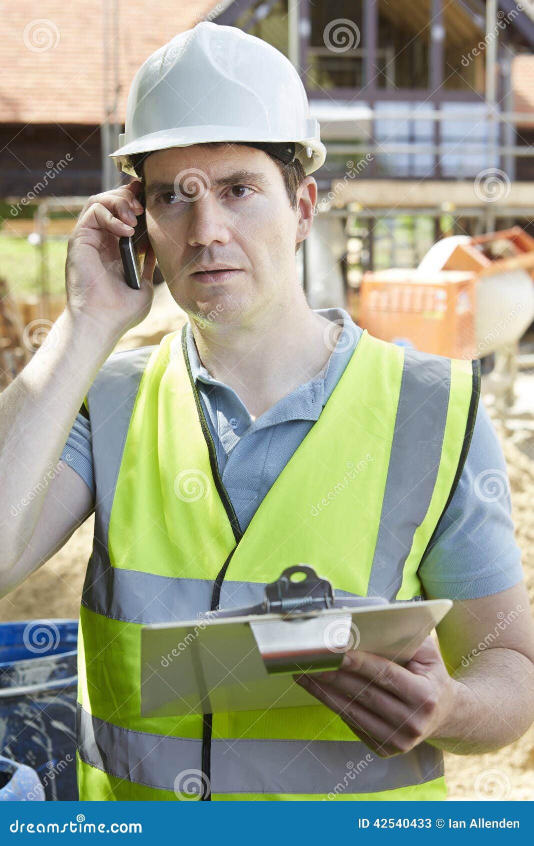 Construction Worker on Building Site Using Mobile Phone Stock Image ...