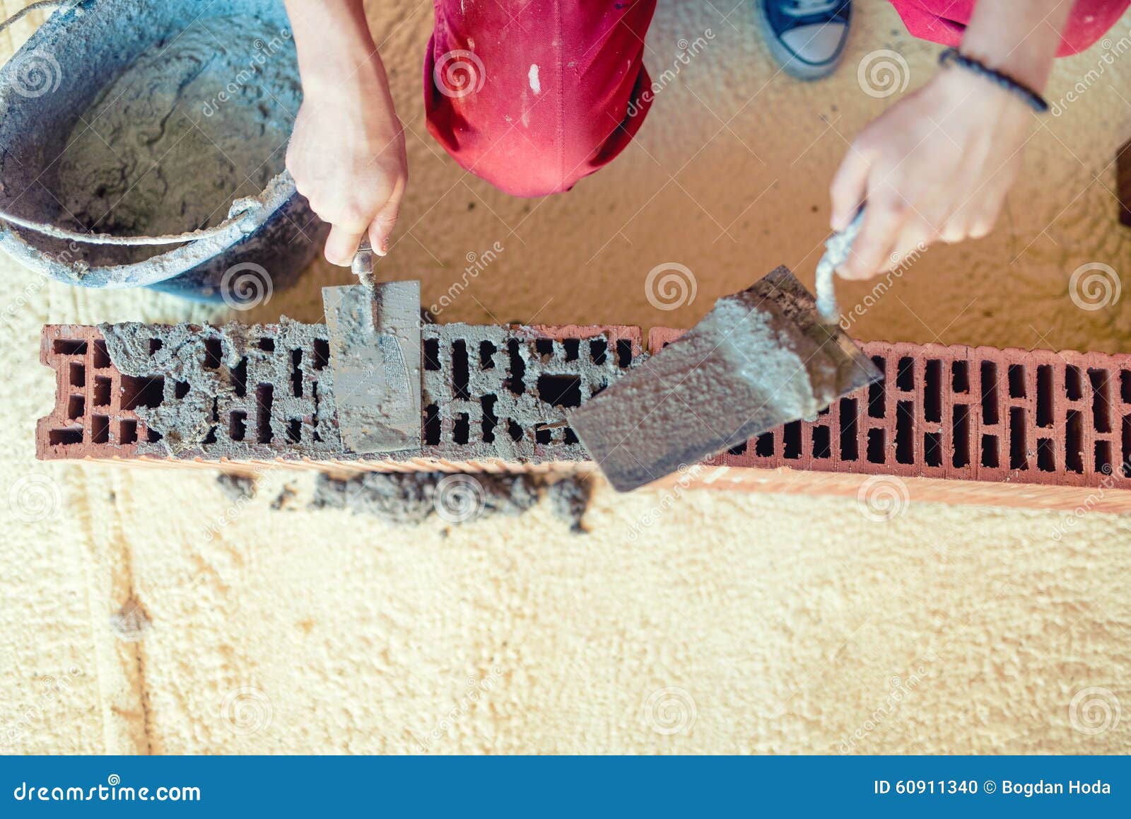 Construction Worker Building Walls and Fixing Bricks with Mortar and ...