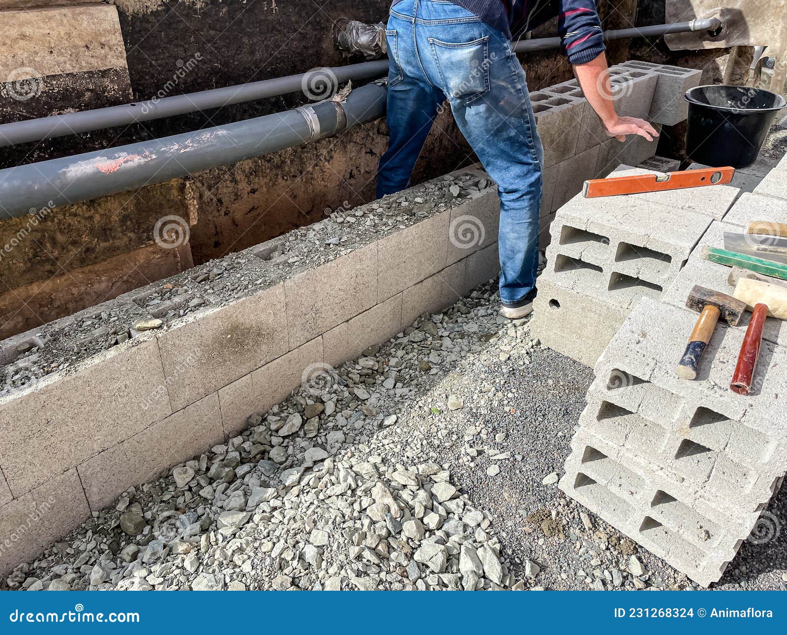 Construction Worker Builds a Concrete Block Wall Stock Photo - Image of ...