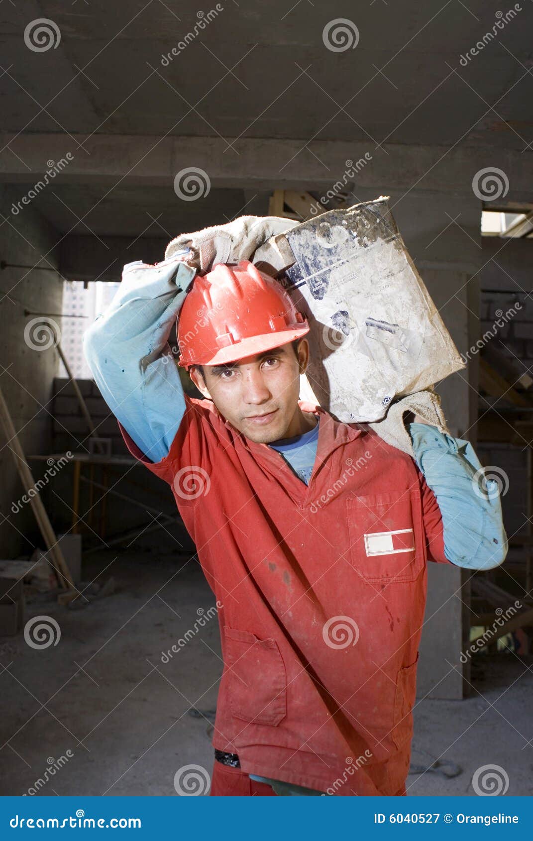 Construction Worker Carrying Material - Vertical Stock Image - Image of ...