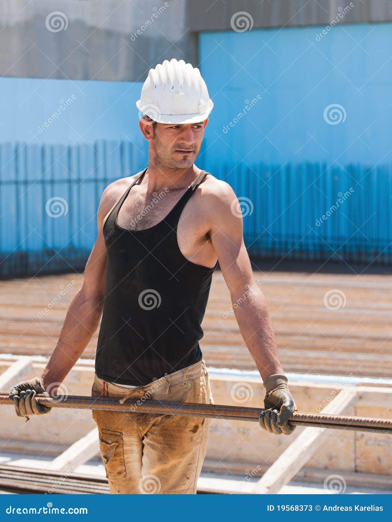 Construction Worker Carrying Steel Bars Stock Image - Image of ...