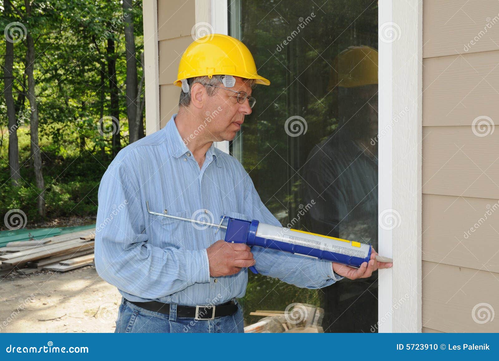 Construction Worker with a Caulking Stock Photo - Image of model ...