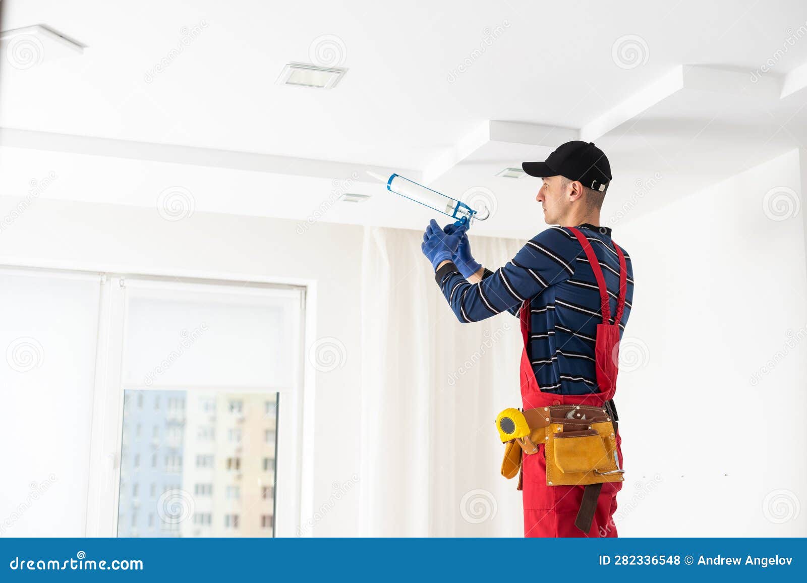 Construction Worker Ceiling Work. Working on Repairs Stock Photo ...