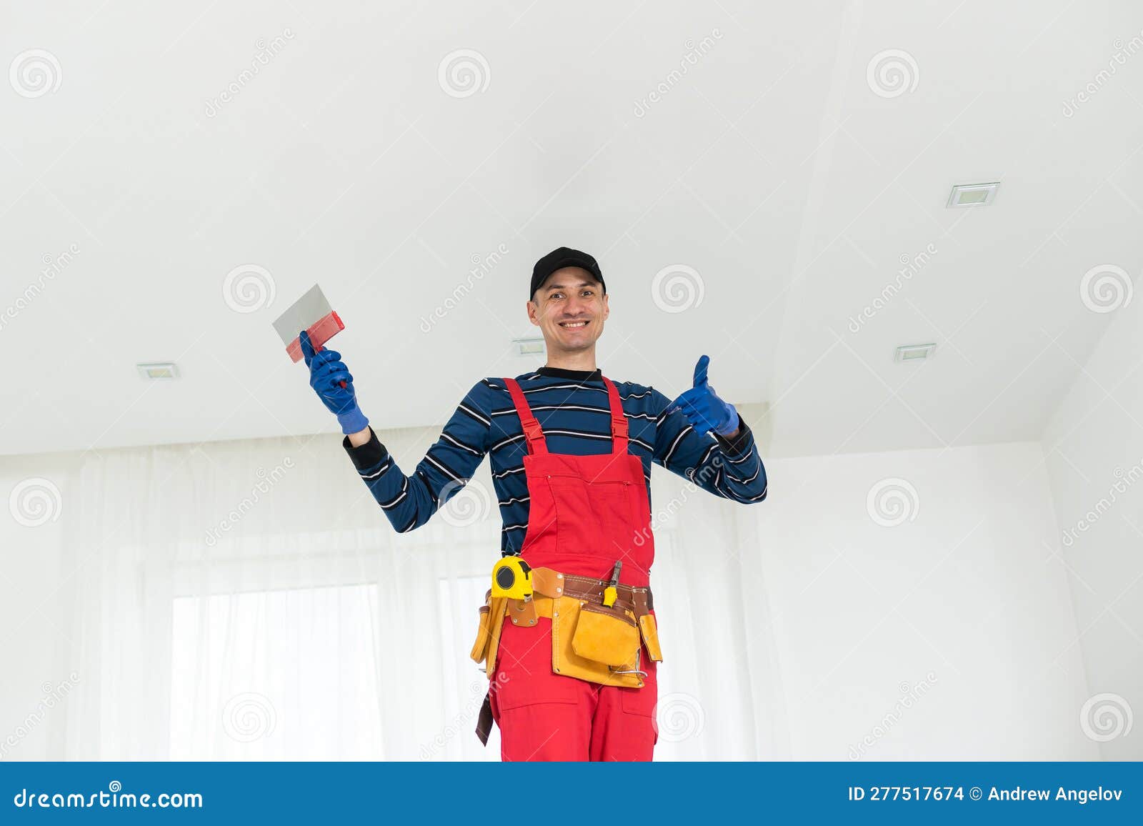 Construction Worker Ceiling Work. Working on Repairs Stock Photo ...