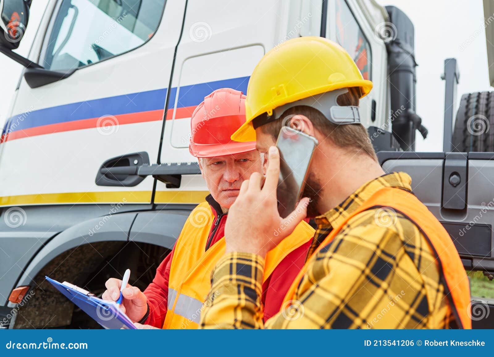 Construction Worker with Cell Phone and Checklist Control Truck Stock ...