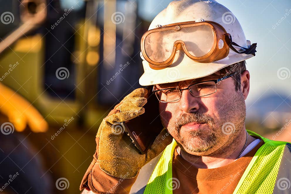 Construction Worker on Cell Phone Stock Image - Image of labor, morning ...