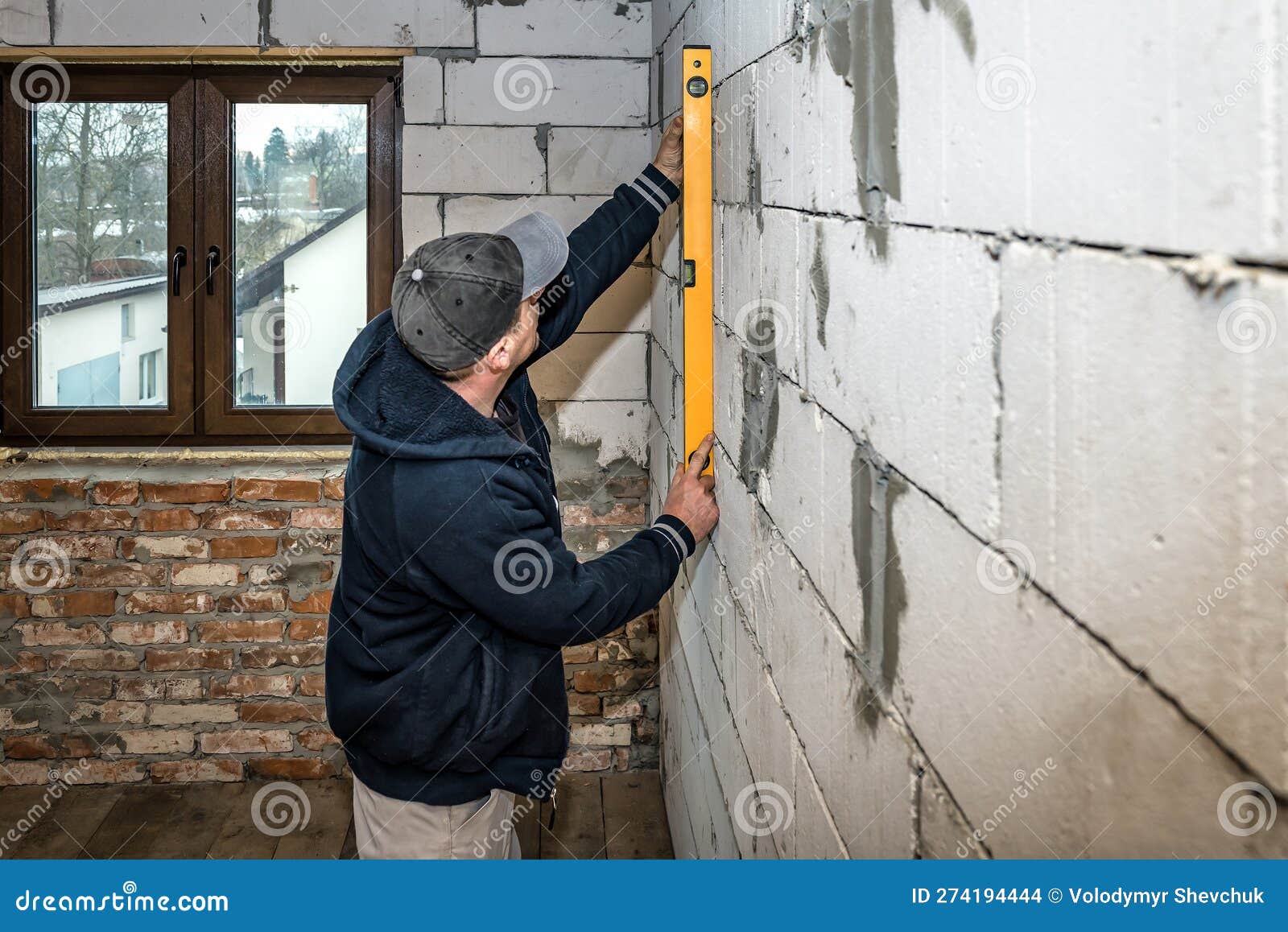 Construction Worker Check the Level on the Wall Stock Photo - Image of ...