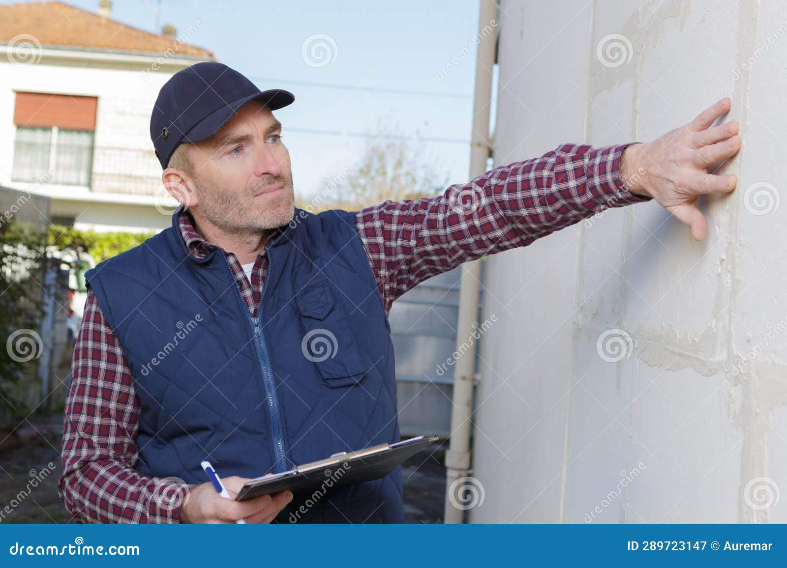 Construction Worker Checking House Wall Stock Image - Image of wall ...