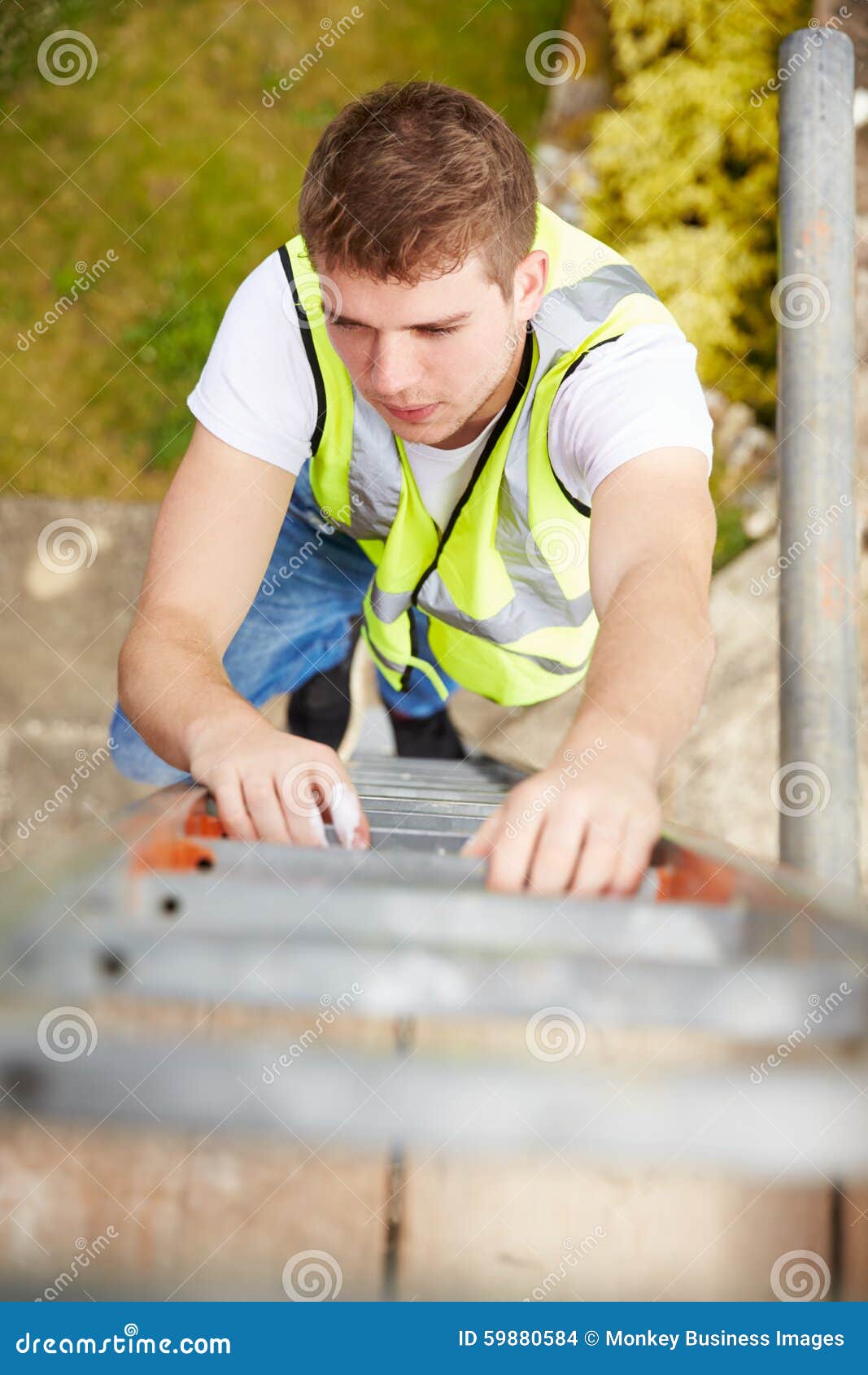 Construction Worker Climbing Ladder on Building Site Stock Photo ...