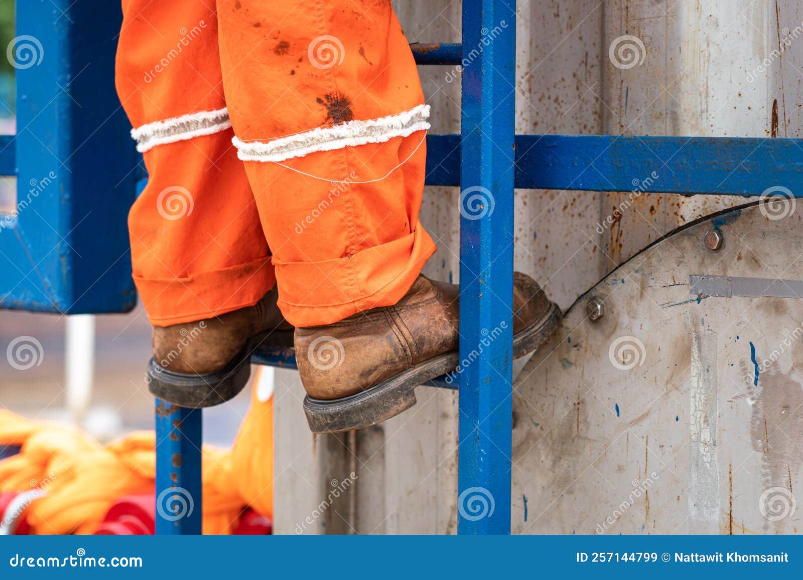 A Construction Worker is Climbing on the Platform Ladder. Stock Image ...