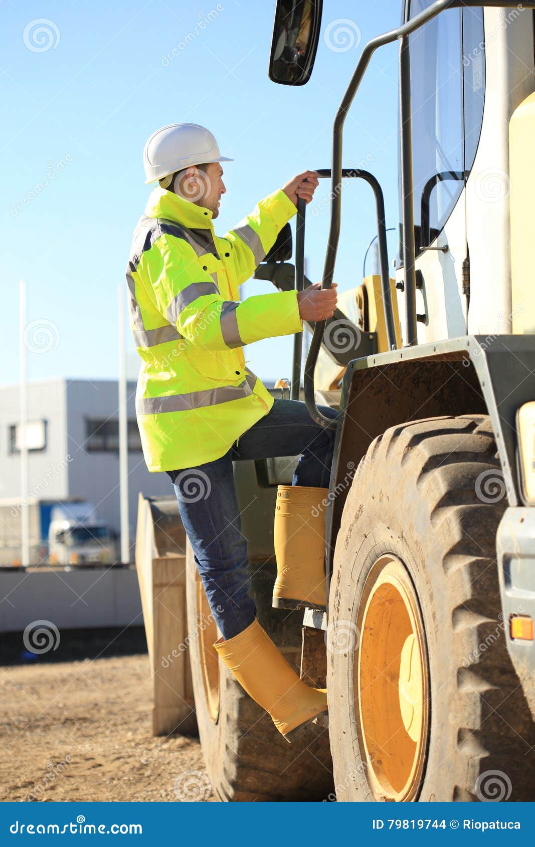 Construction Worker Climbing a Wheel Loader Stock Photo - Image of ...
