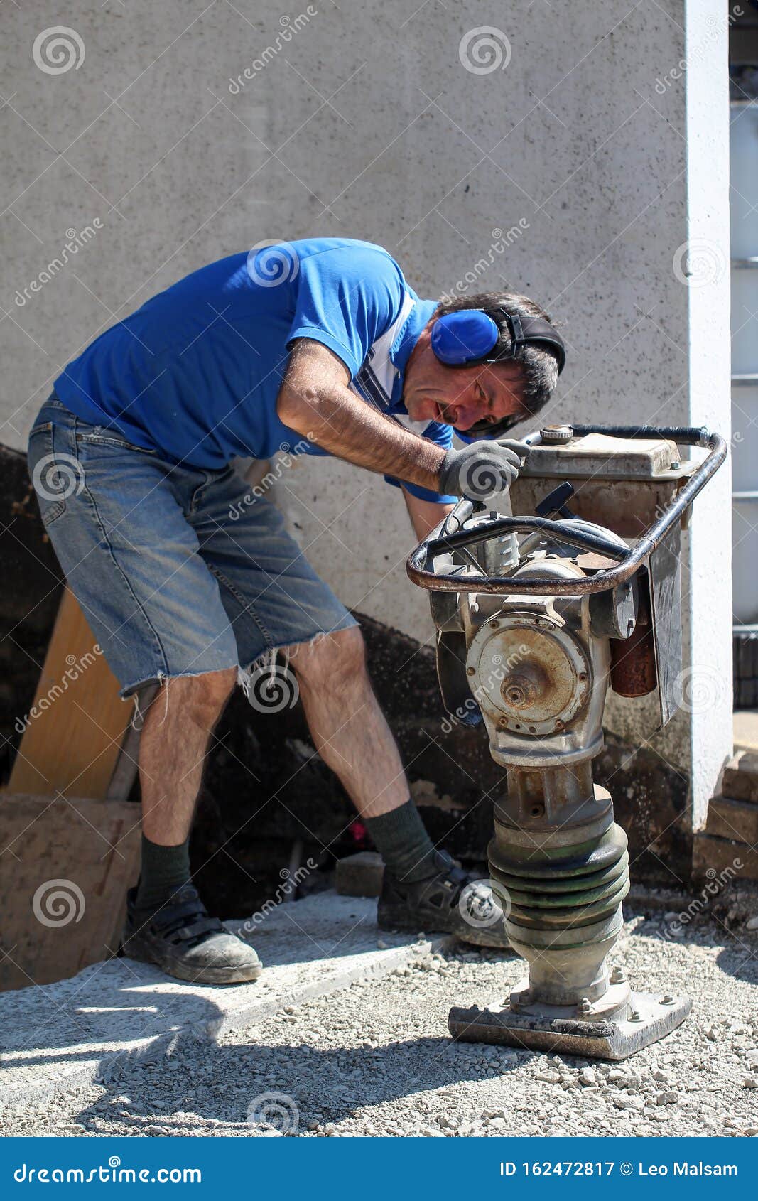 Construction Worker Compacting Soil Using Compactor. Stock Image ...
