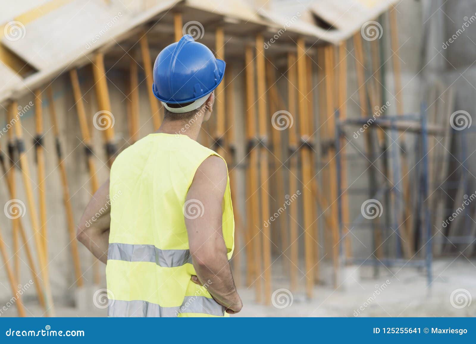 Construction Worker in Construction Site Back Detail, Looking at Stock ...