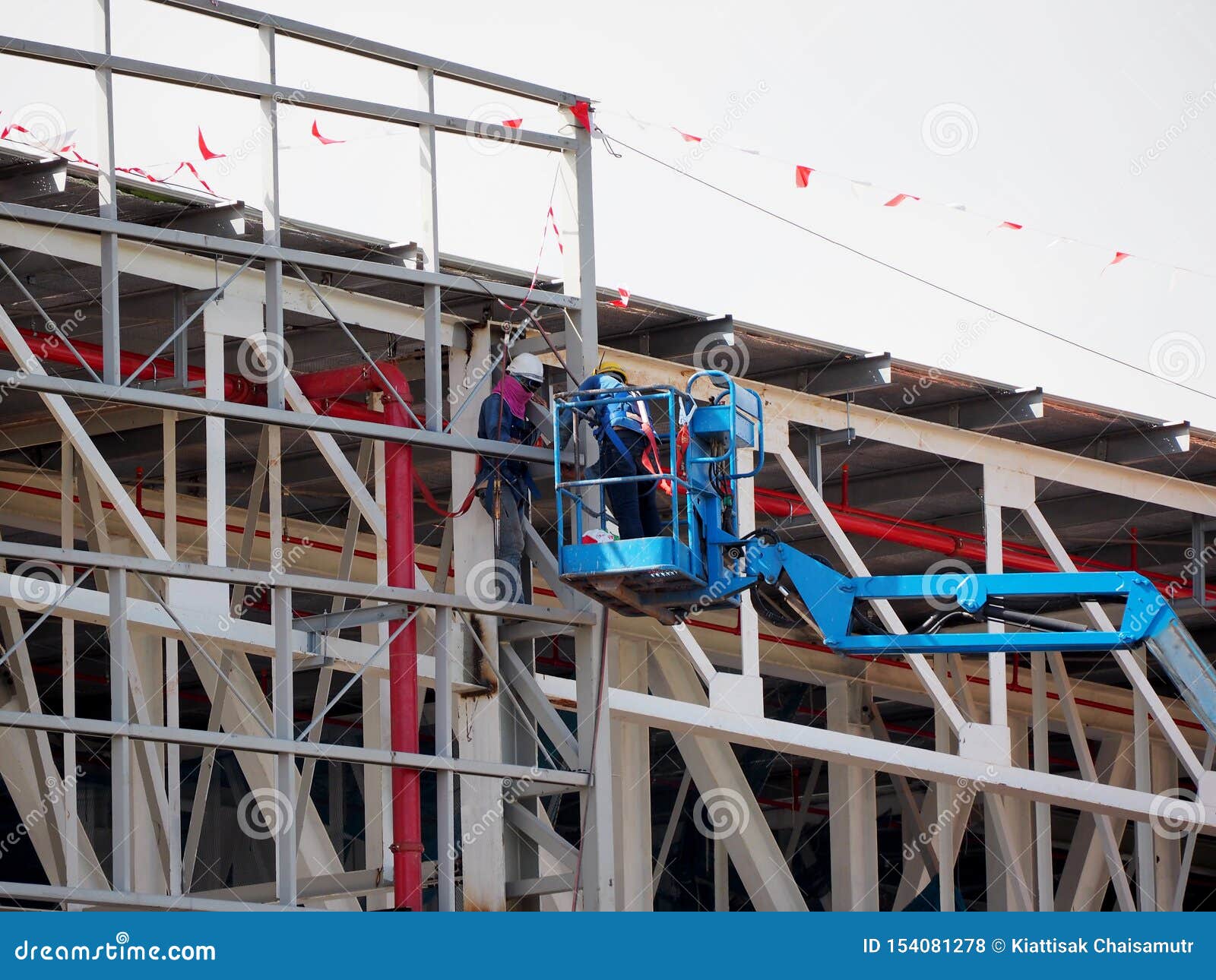 Construction Worker Using Lifting Boom Stock Photo - Image of building ...