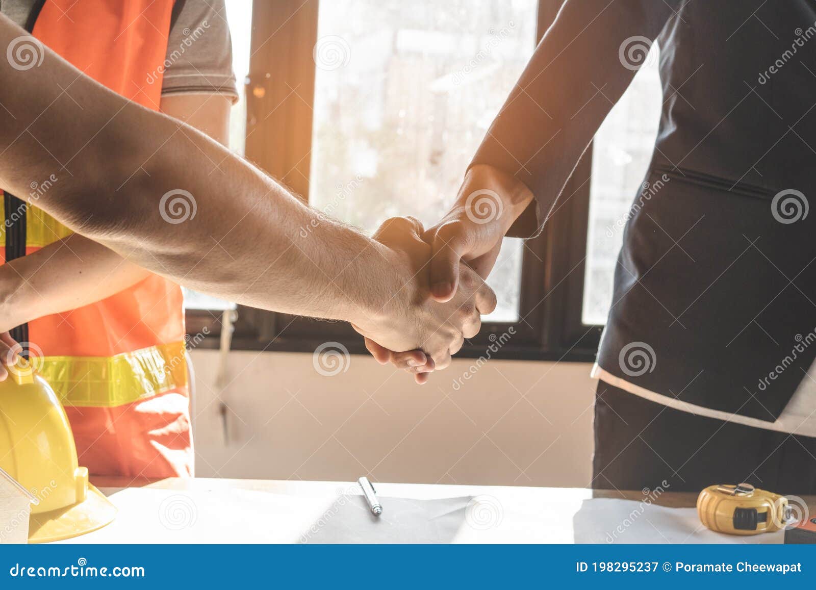 Construction Worker and Contractor. Client Shaking Hands with Team ...