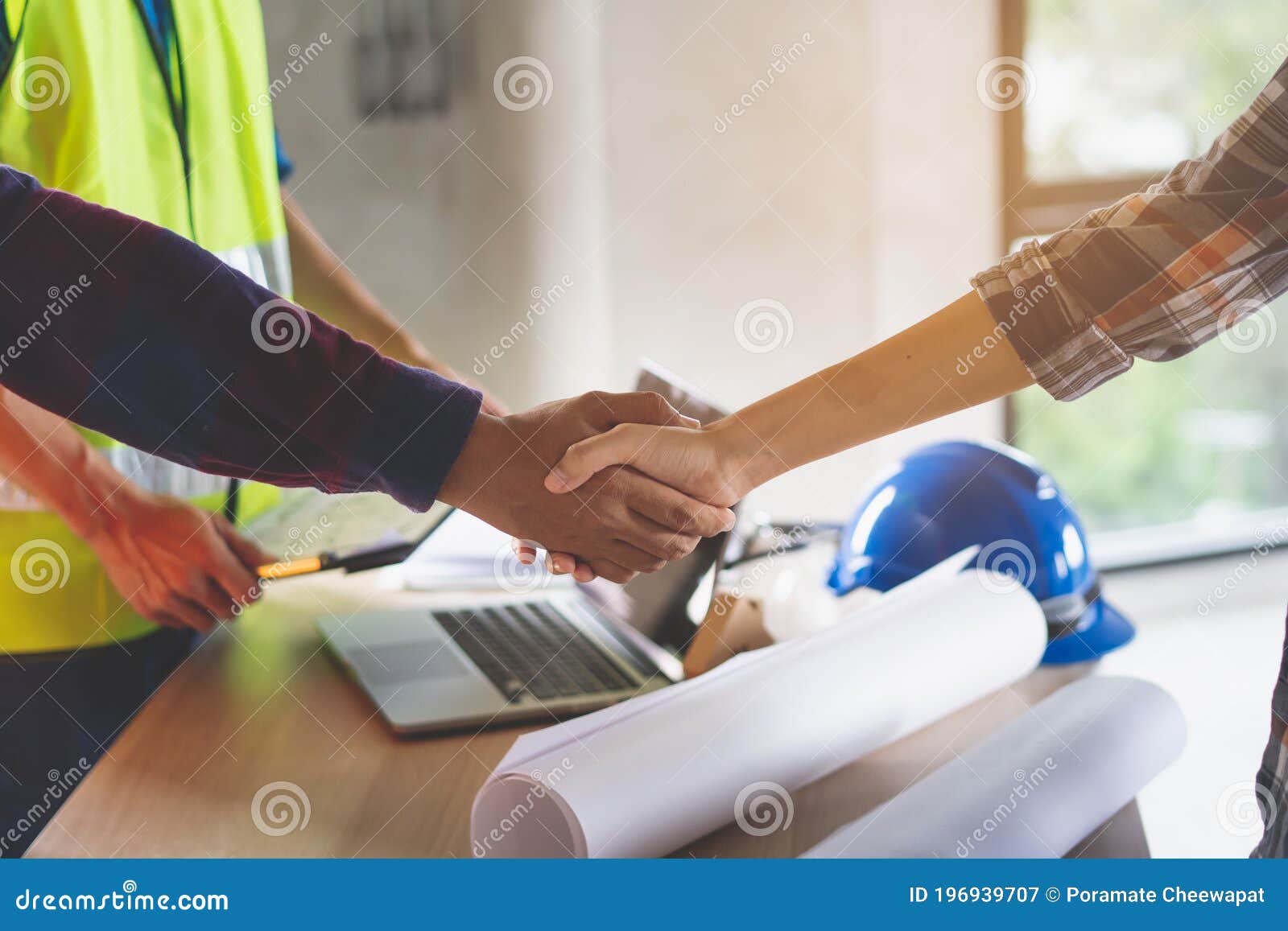 Construction Worker and Contractor. Client Shaking Hands with Team ... Construction Worker and Contractor. Client Shaking Hands with Team ...