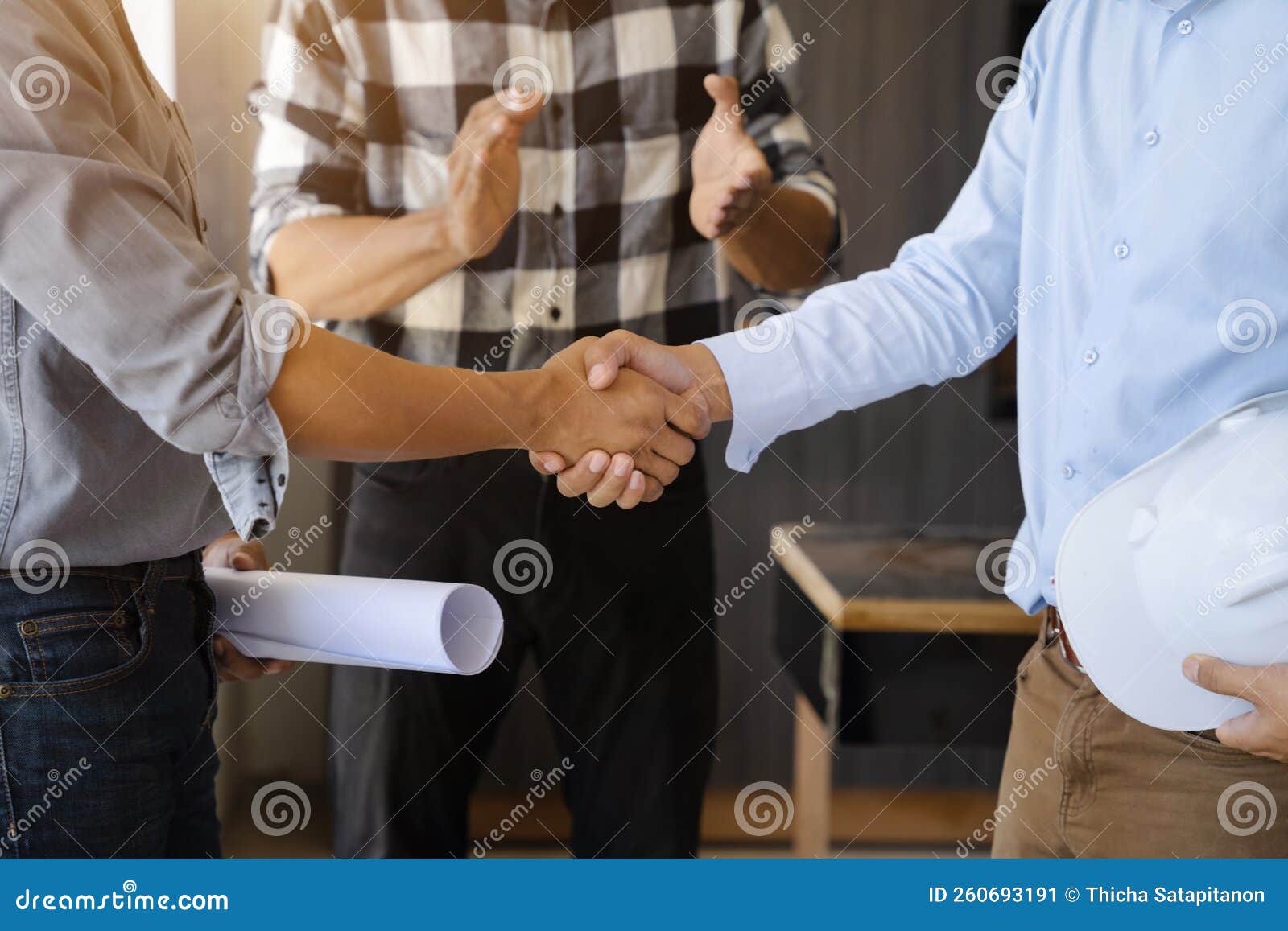 Construction Worker and Contractor. Client Shaking Hands with Team ...