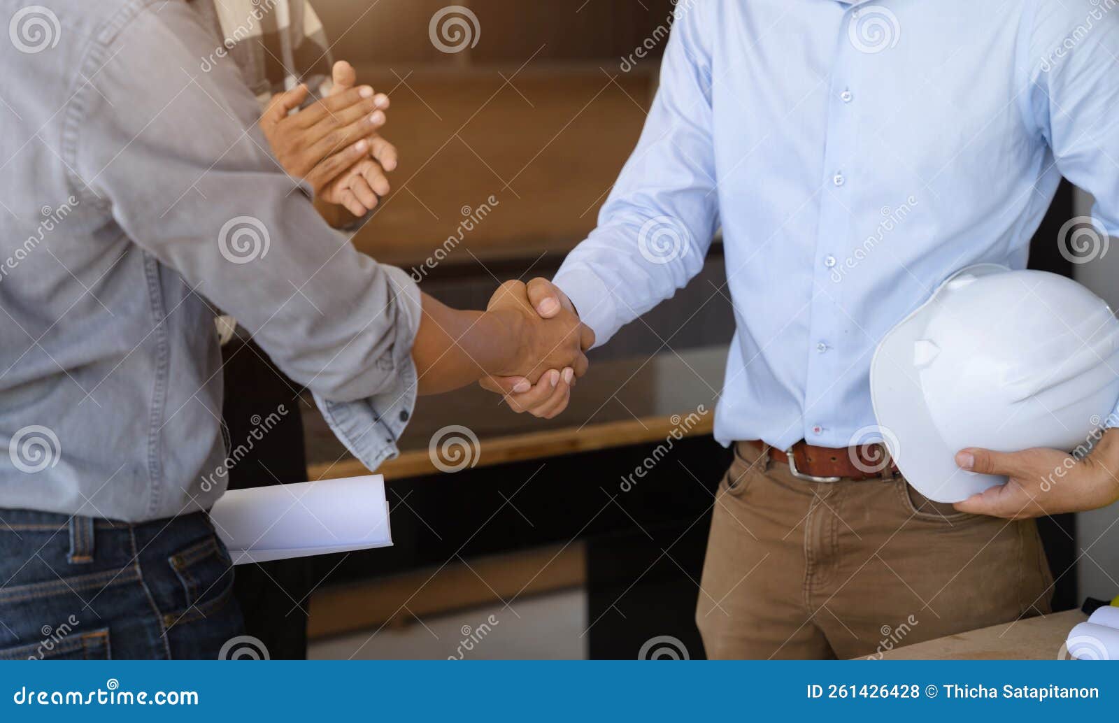 Construction Worker and Contractor. Client Shaking Hands with Team ...