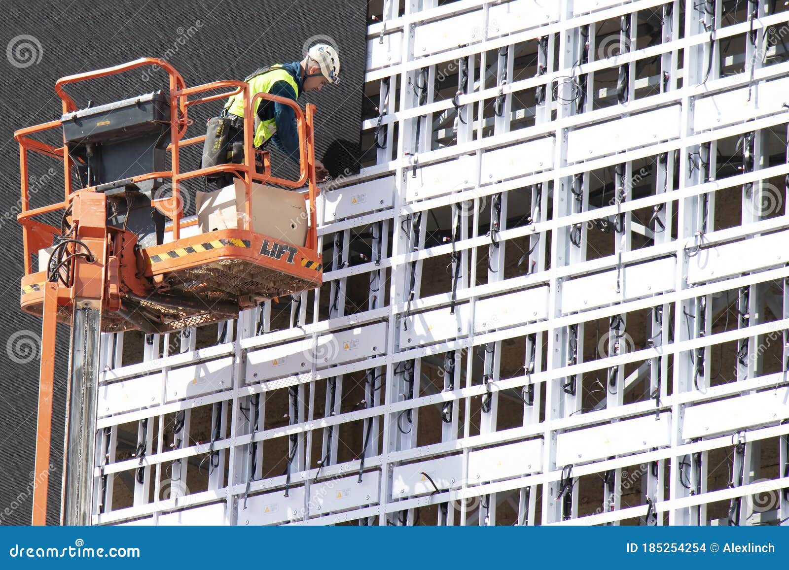 Construction Worker in Crane Basket Installing Sheets Cladding for ...