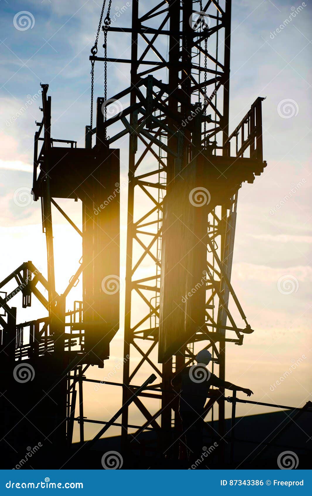 Construction Worker, Crane and Building at Sunset Stock Photo - Image ...