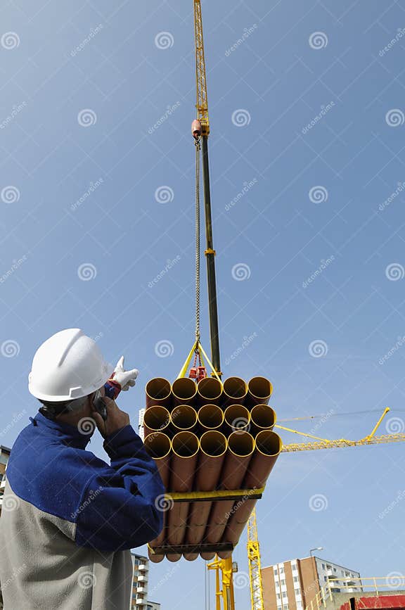 Construction Worker and Crane Load Stock Photo - Image of crane ...