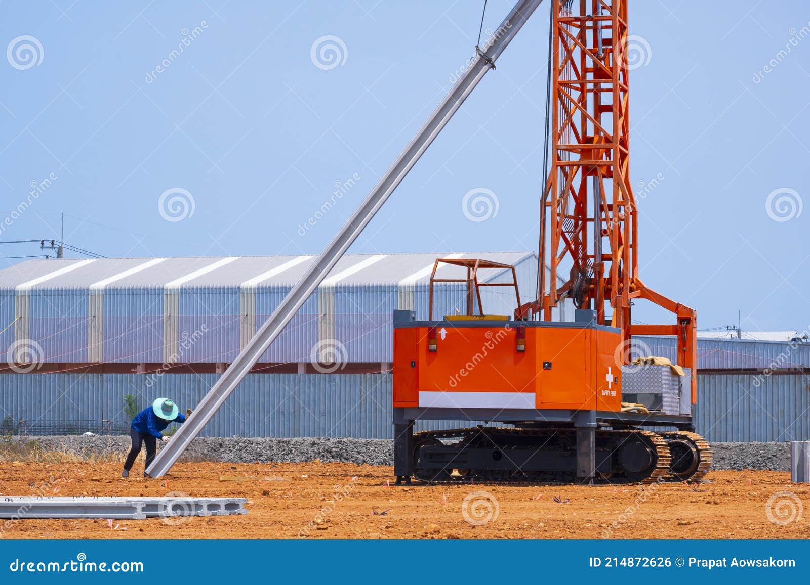 Construction Worker with Crawler Pile Driver Machine Lifting Concrete ...