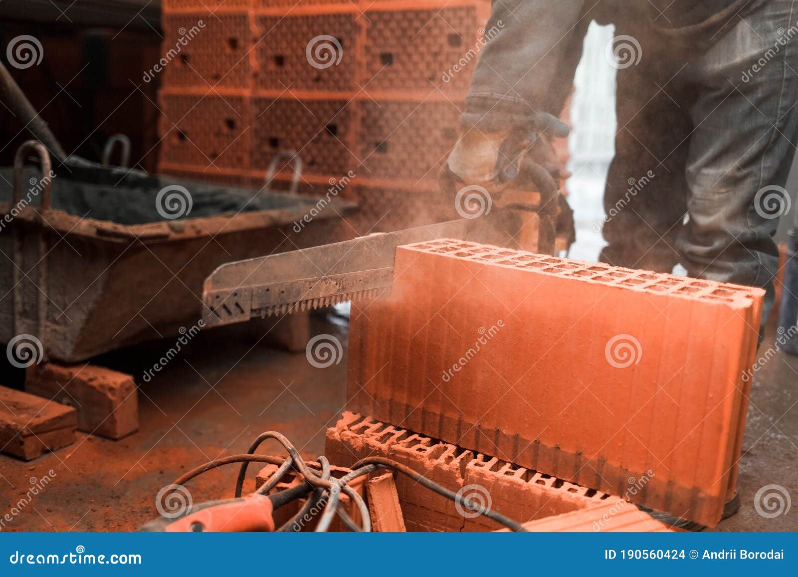 Construction Worker Cuts a Brick with a Saw Stock Photo - Image of ...