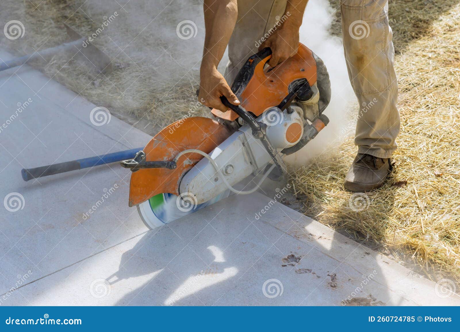 Construction Worker Cutting Concrete Sidewalk Using a Diamond Saw Blade ...